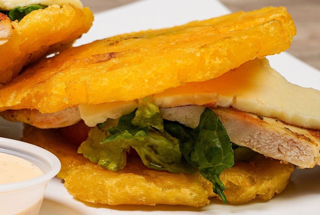 Pechuga de Pollo Asada Toston Sandwich – Cali Aji, Latin Kitchen & Bakery